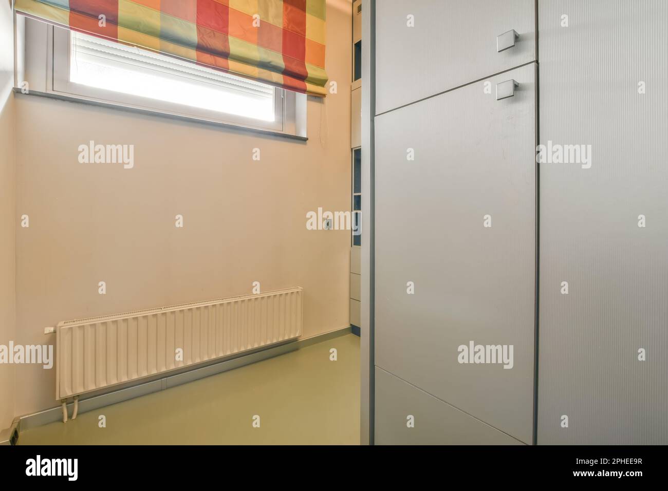 Corner view of interior design of bedroom with color curtains on glass ...