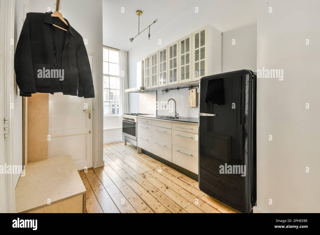 Interior of modern kitchen with adequate daylight white walls minimal ...