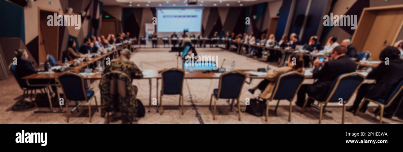 Business meeting in a large, modern hall. A meeting of highly ...