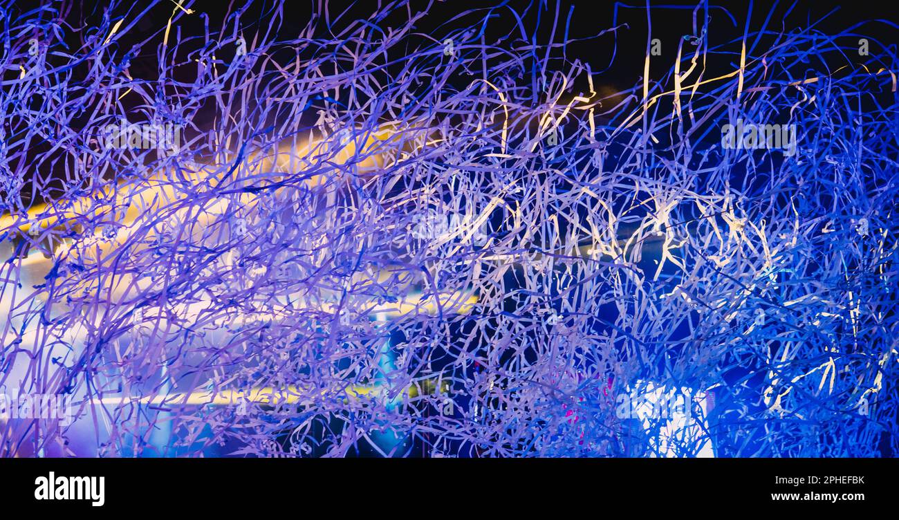 From below fragment of metal stage installation with flying ribbons and ...