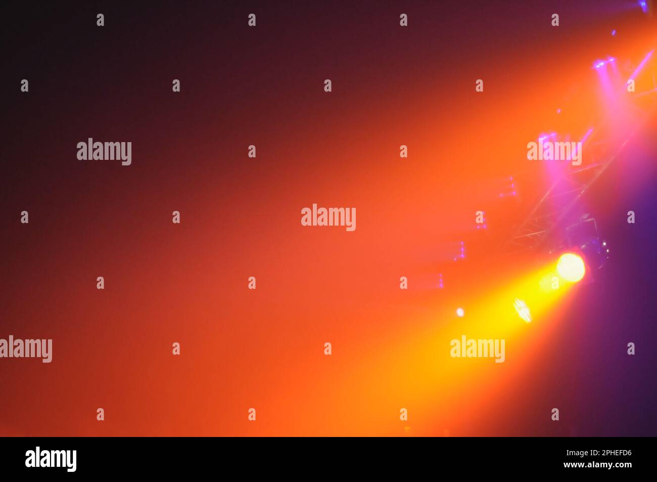 From below shot of bright beams of laser lights illuminating music ...