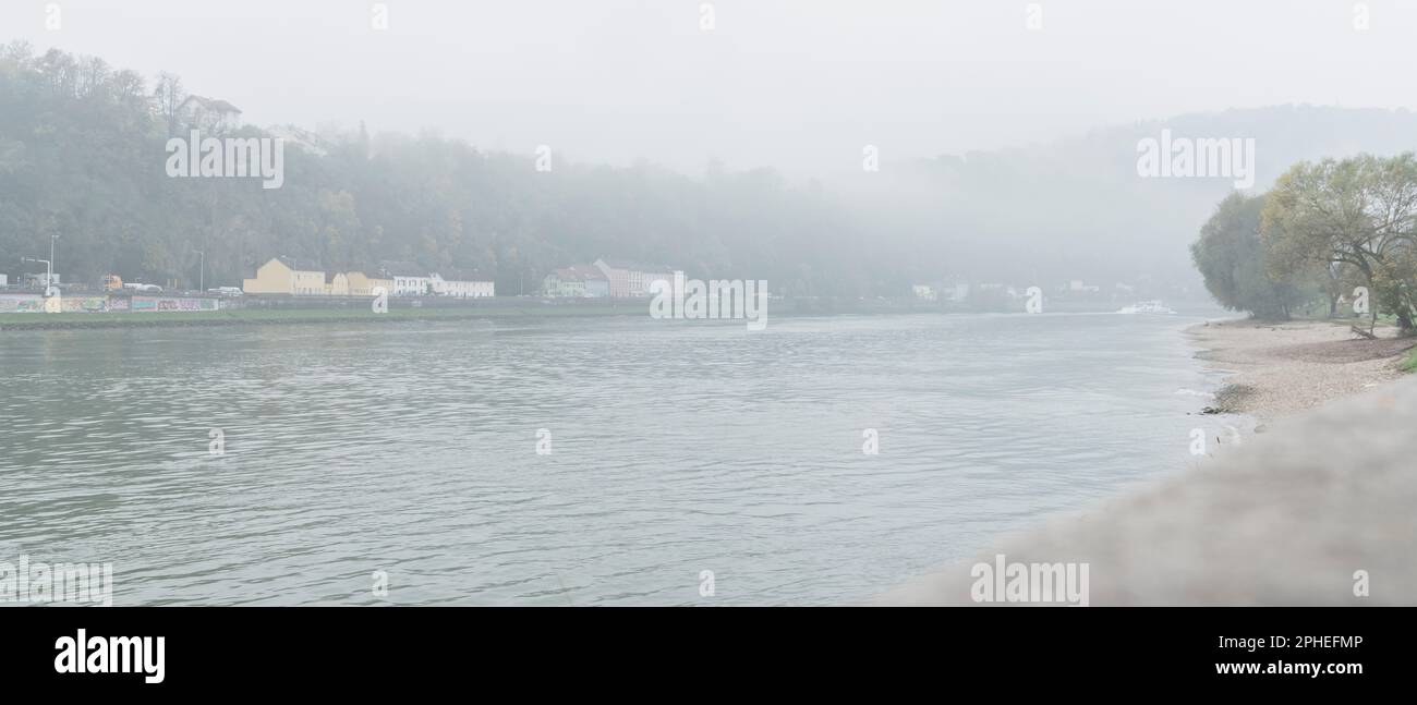 Houses located near city channel and bridge in haze Stock Photo - Alamy
