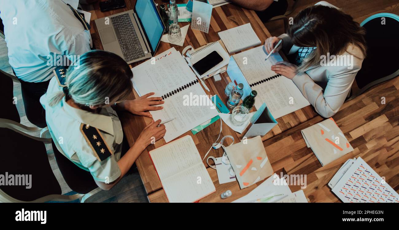 Top view of colleagues sorting out paperwork together. Businessman ...