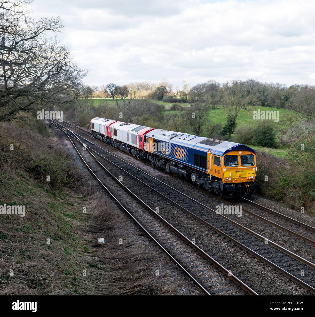 GBRf class 66 diesel locomotive No. 66799 pulling Akiem class 77 diesel ...