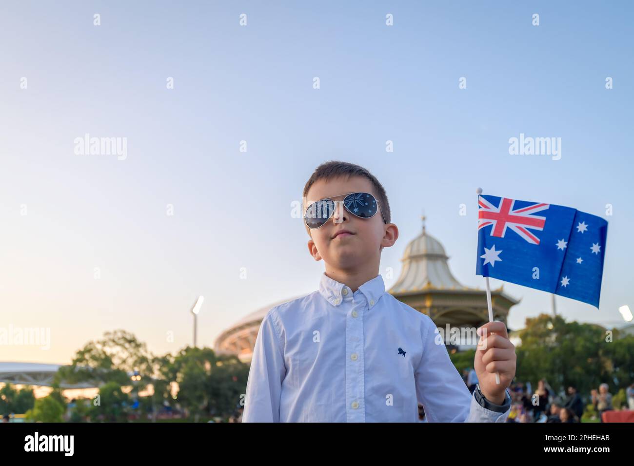 Australian kid holding a flag while celebrating Australia day in ...