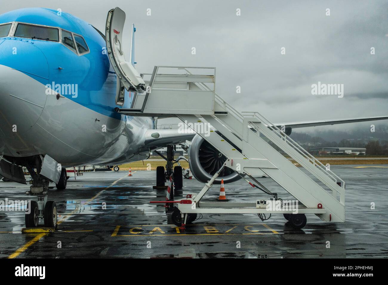 Boeing 737 with steps up to front of plane, sitting at stand Chambery ...