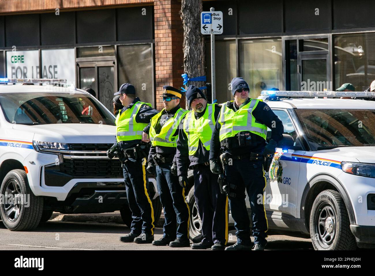 Edmonton, Canada. 27th Mar, 2023. Police officers pay respect during a ...