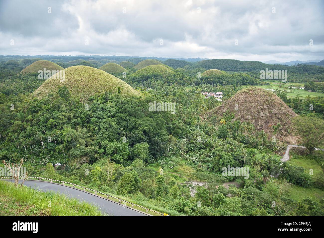 The dome- and cone-shaped chocolate hills of Bohol in the Philippines ...