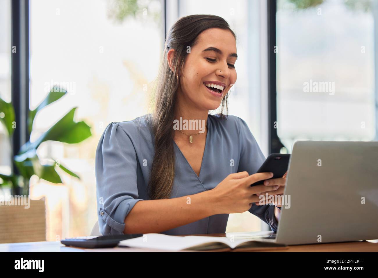 Phone, happy and business woman laughing while texting in office ...