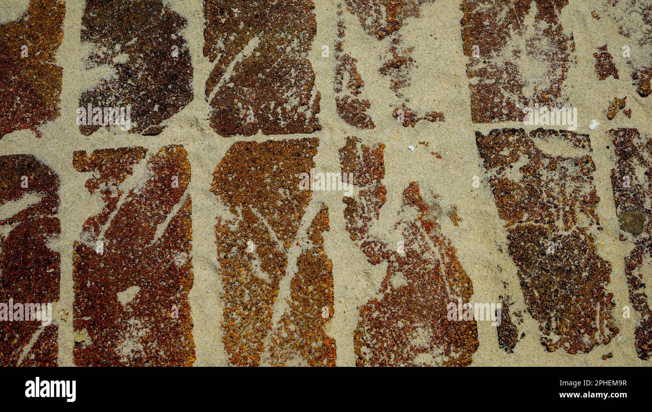 Abstract pattern of paved pathway in the sand Stock Photo - Alamy