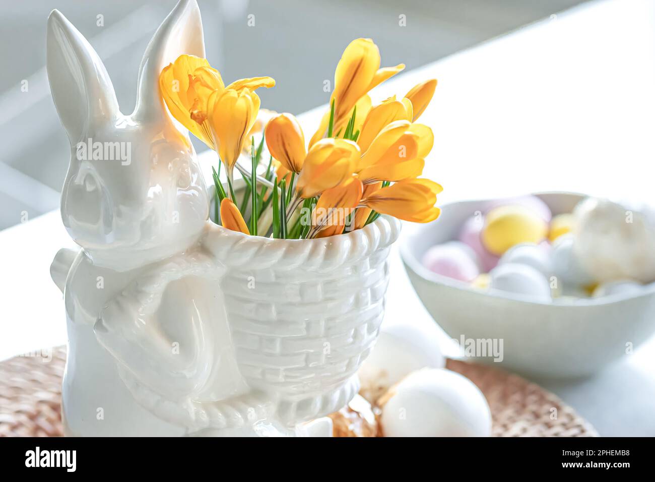 Easter still life with a ceramic hare, eggs and flowers Stock Photo - Alamy