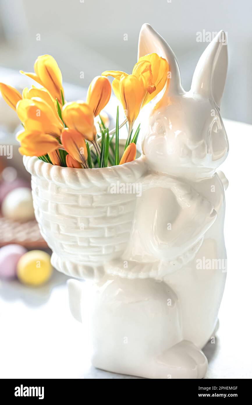 Easter still life with a ceramic hare, eggs and flowers Stock Photo - Alamy