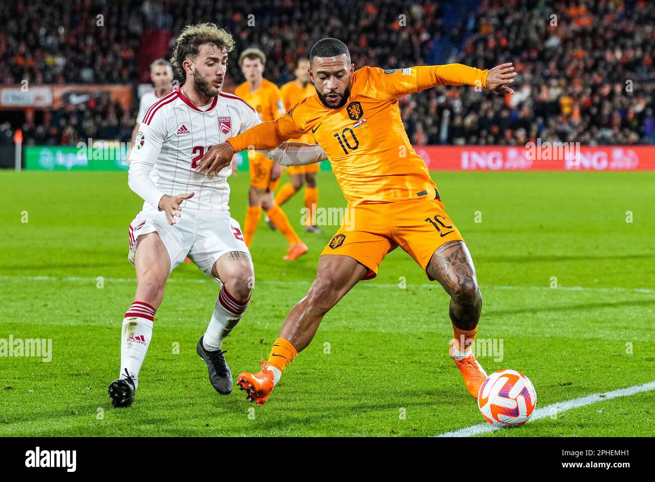 Rotterdam - Ethan Britto of Gibraltar, Memphis Depay of Holland during ...