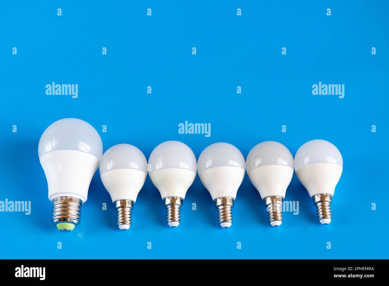 Energy-saving LED light bulbs on a blue background Stock Photo - Alamy