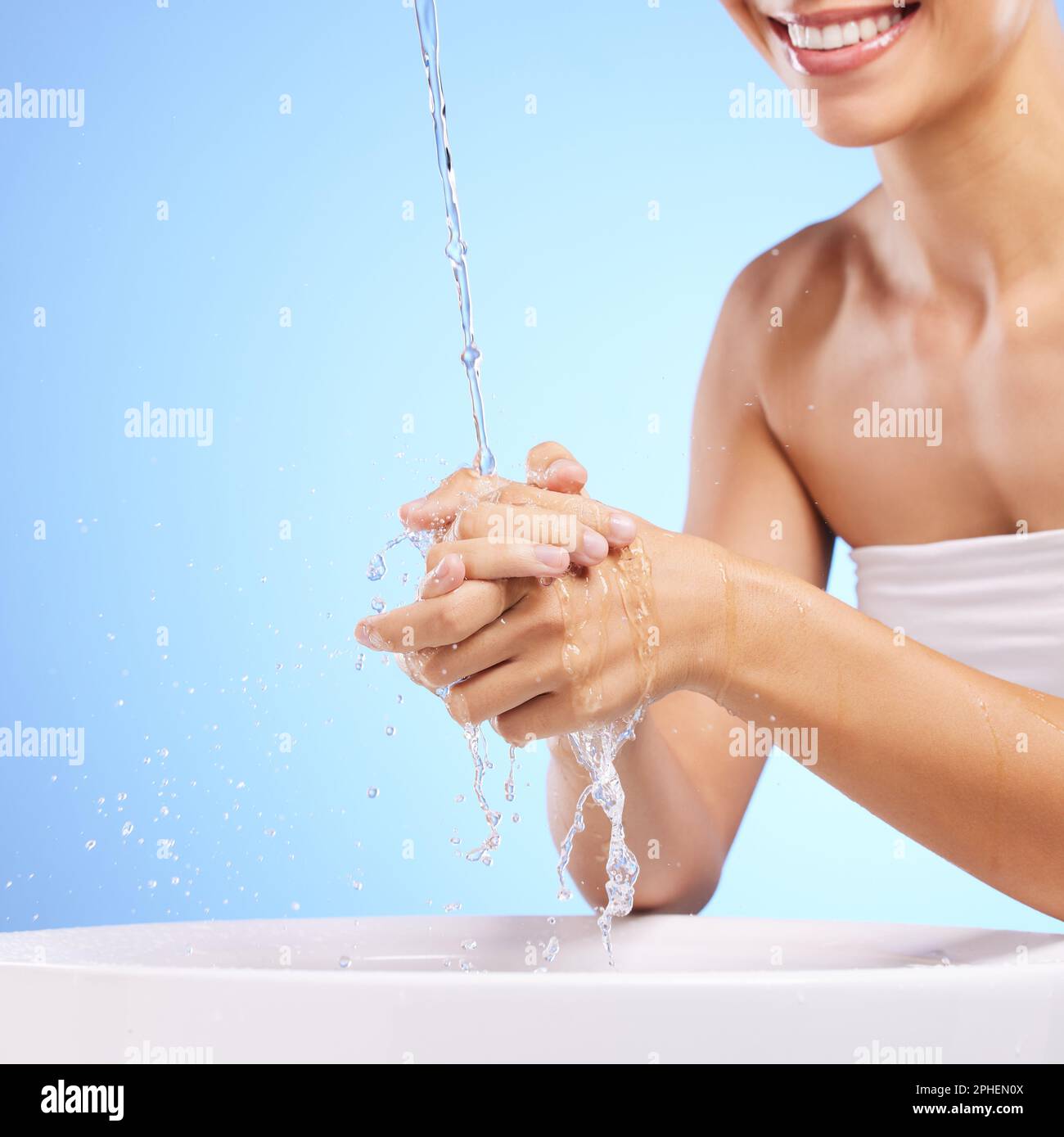 Water, happy woman or washing hands in studio on blue background for ...