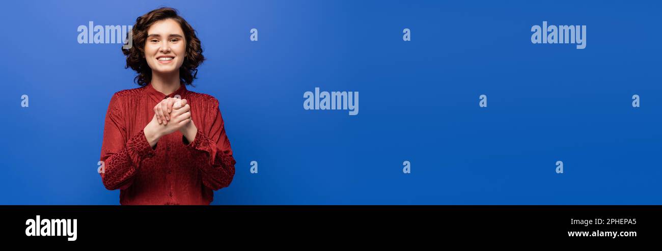 excited woman showing handshake gesture meaning togetherness on sign ...