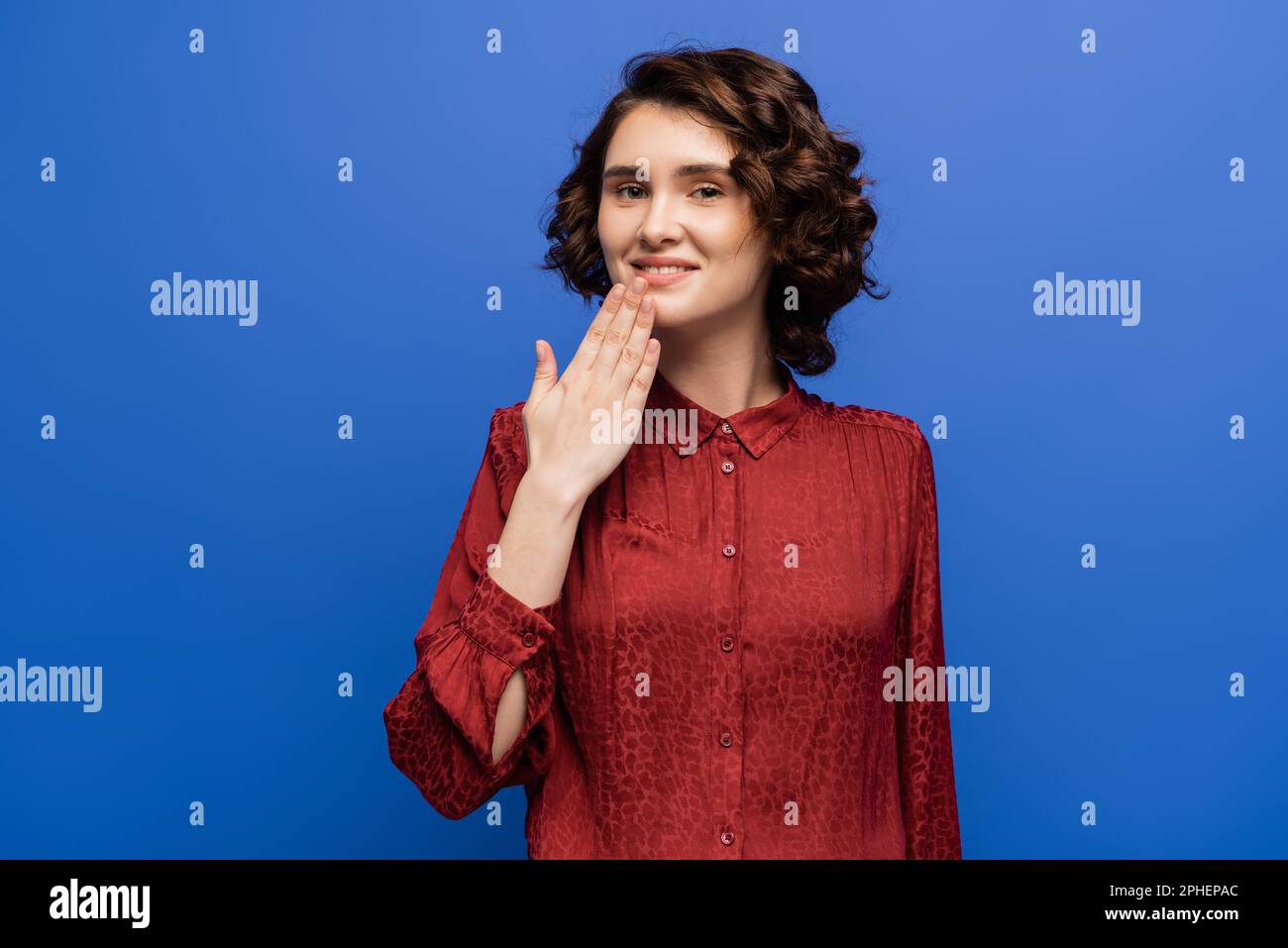 smiling teacher showing thank you gesture on sign language isolated on ...