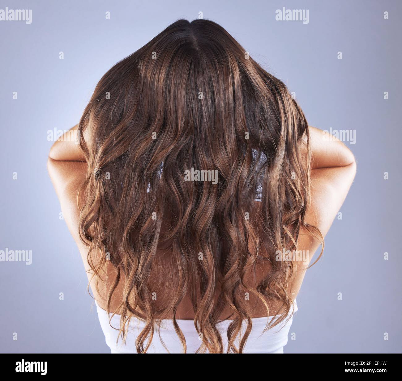 Woman, beauty and hair in studio for curls, growth and healthy shine on ...