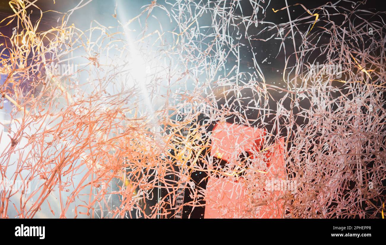 From below fragment of metal stage installation with flying ribbons and ...