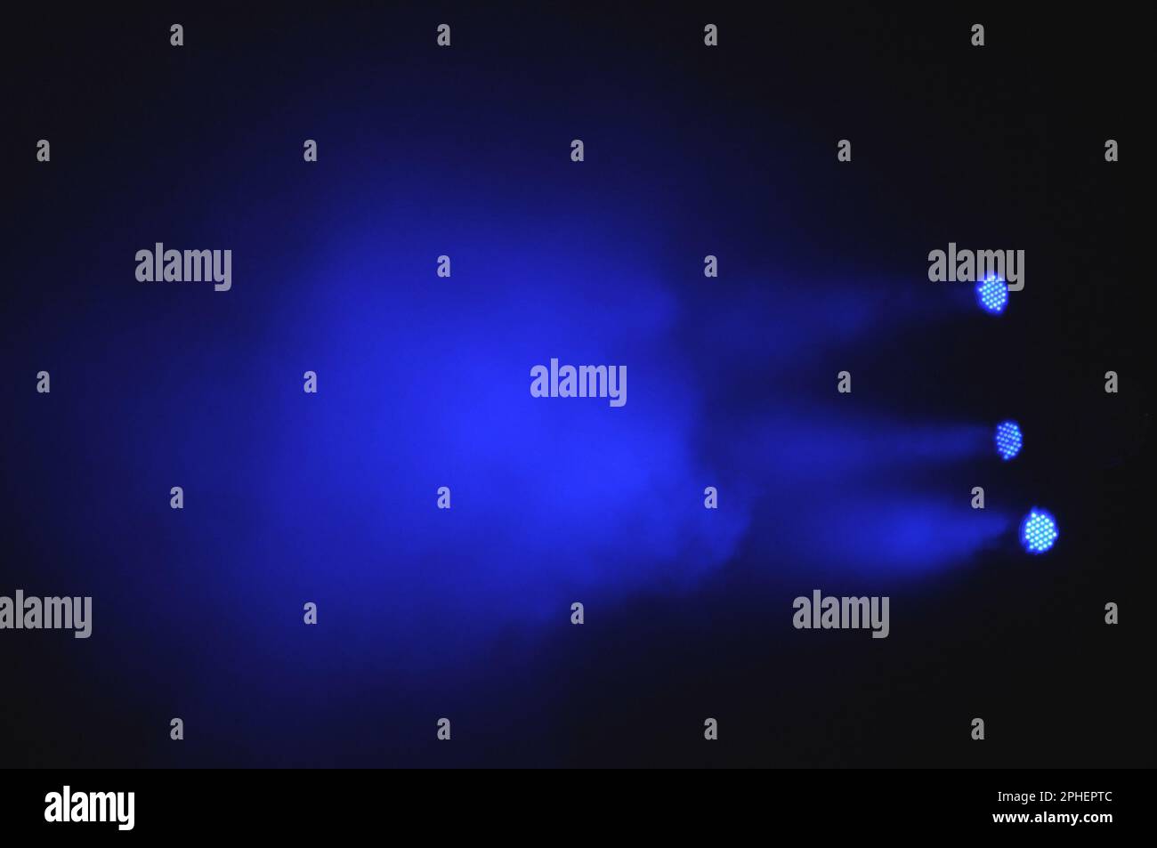 From below shot of bright beams of laser lights illuminating music ...