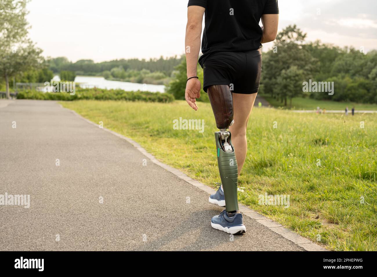 Details of a walk of a young man with prosthetic leg, young man with ...