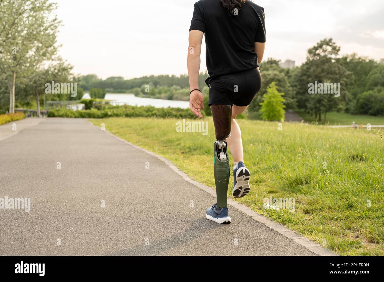 Details of a walk of a young man with prosthetic leg, young man with ...