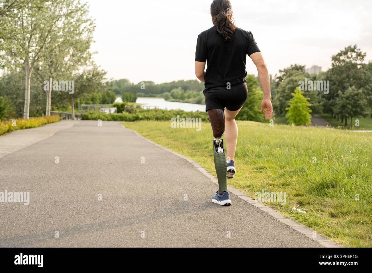 Details of a walk of a young man with prosthetic leg, young man with ...