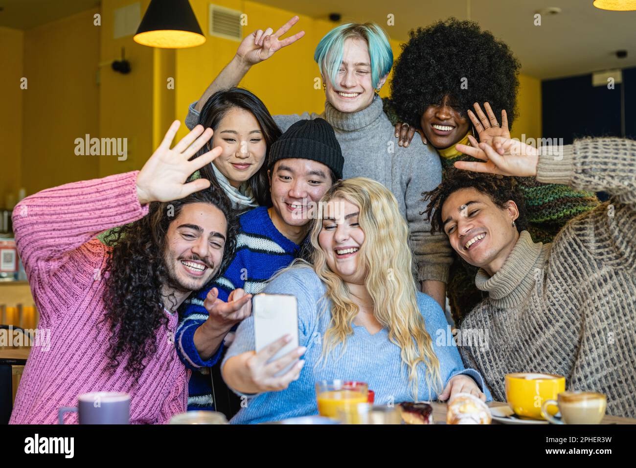 Young curvy woman takes a photo with her best friends during a ...