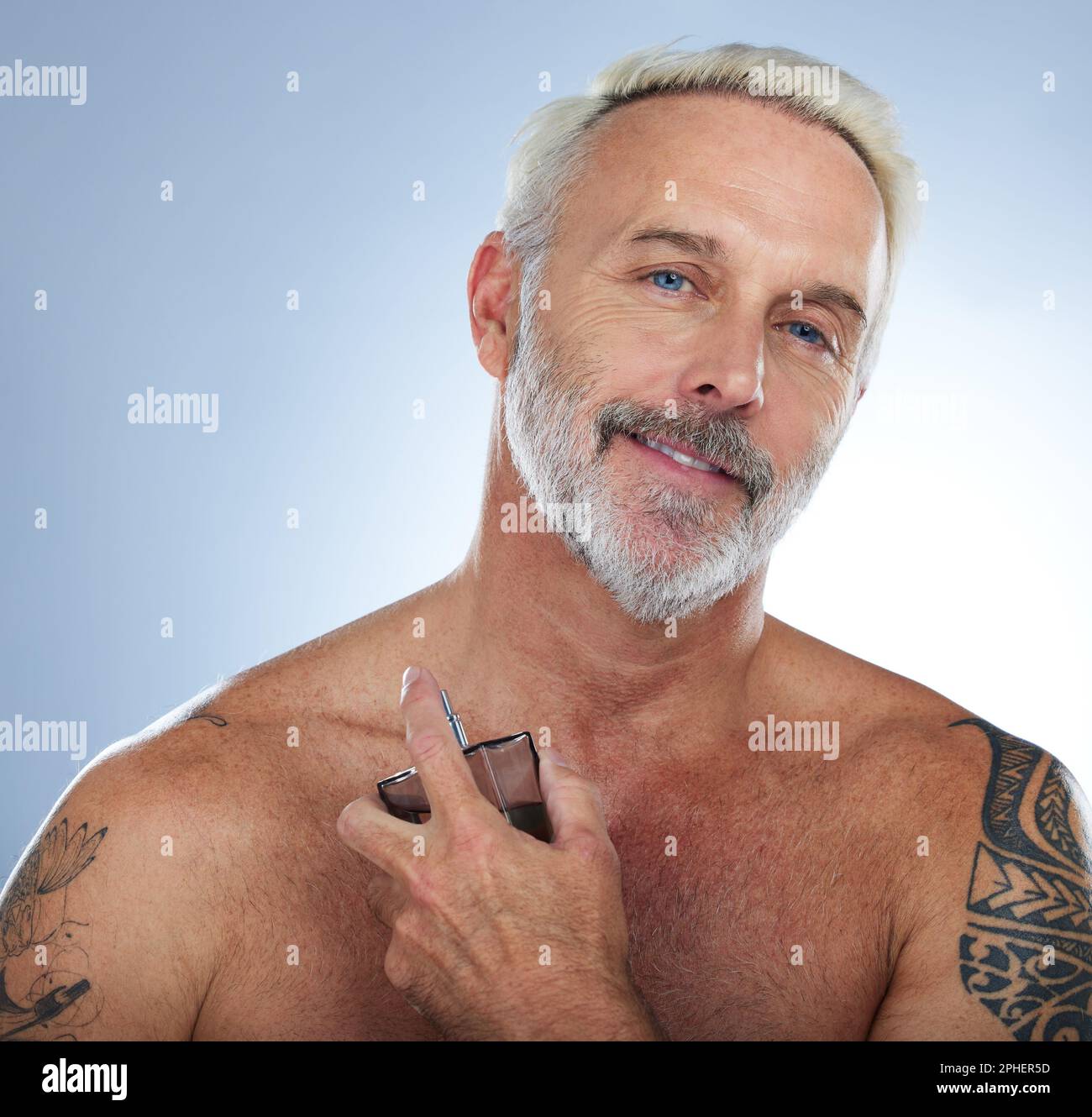 Senior man, cologne bottle and portrait in a studio with male model and ...