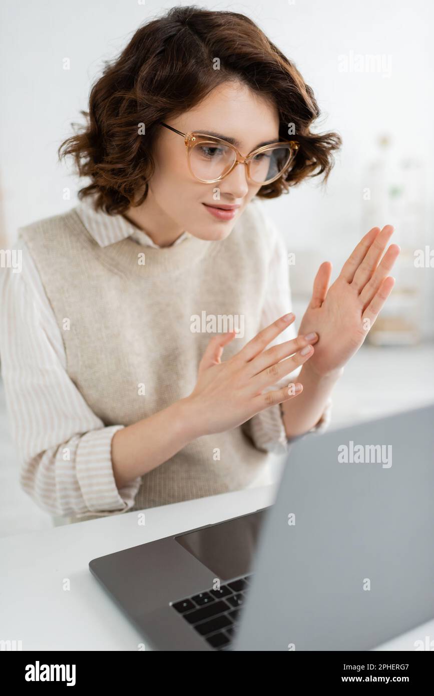 cheerful teacher in glasses showing two handed sign language gesture ...