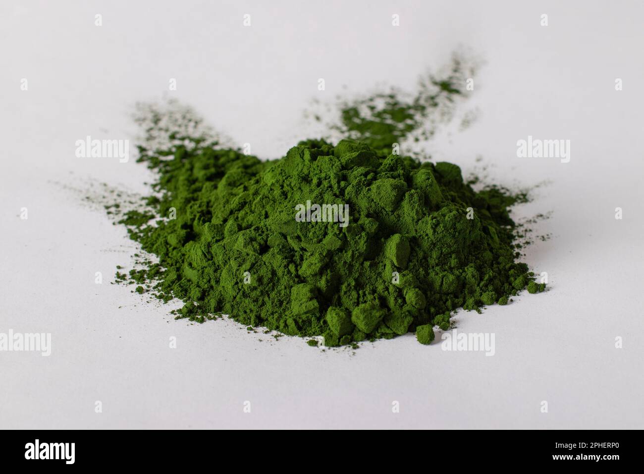 Chlorella algae powder scattered on white background, Closeup Stock ...