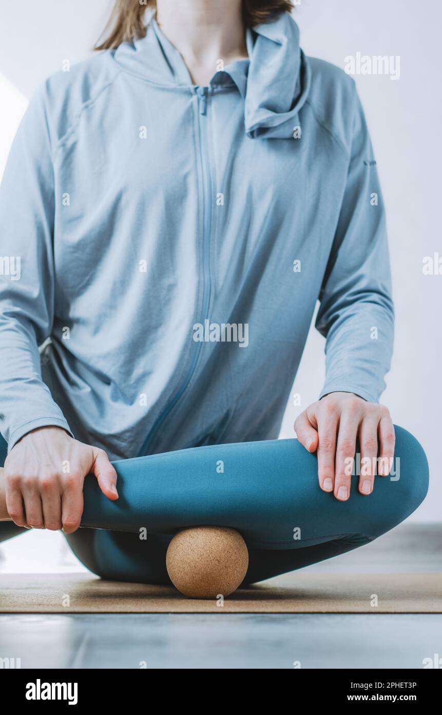Person Doing Self Myofascial Release On Shin Muscles With Cork Ball