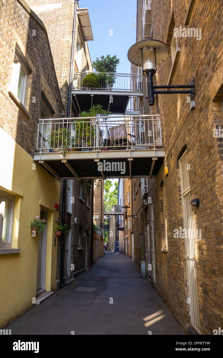 Rotherhithe Street as it runs between old warehouse buildings ...