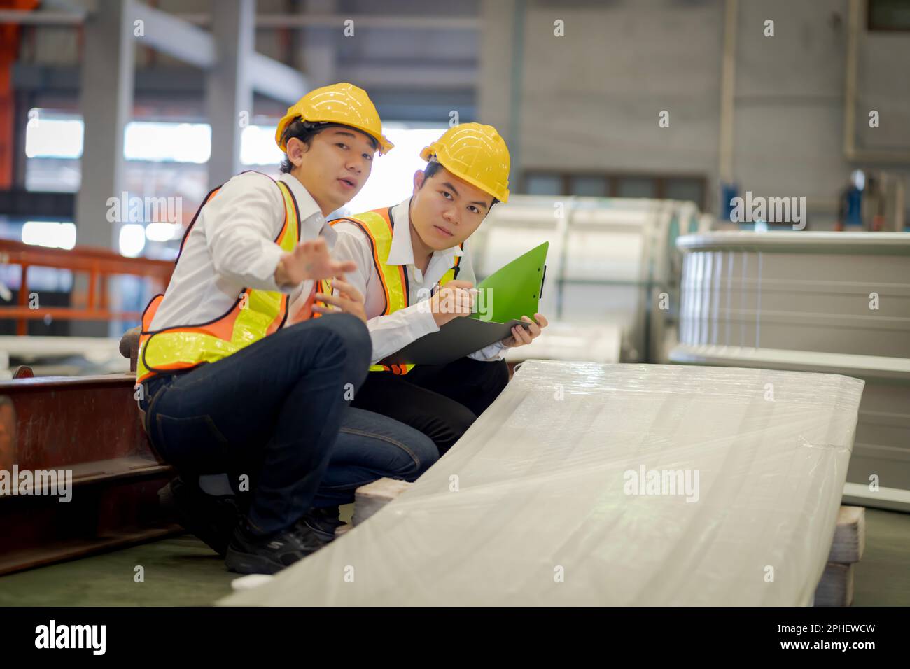 A new generation of engineers in a metal sheet factory. Studying work methods from supervisors ...
