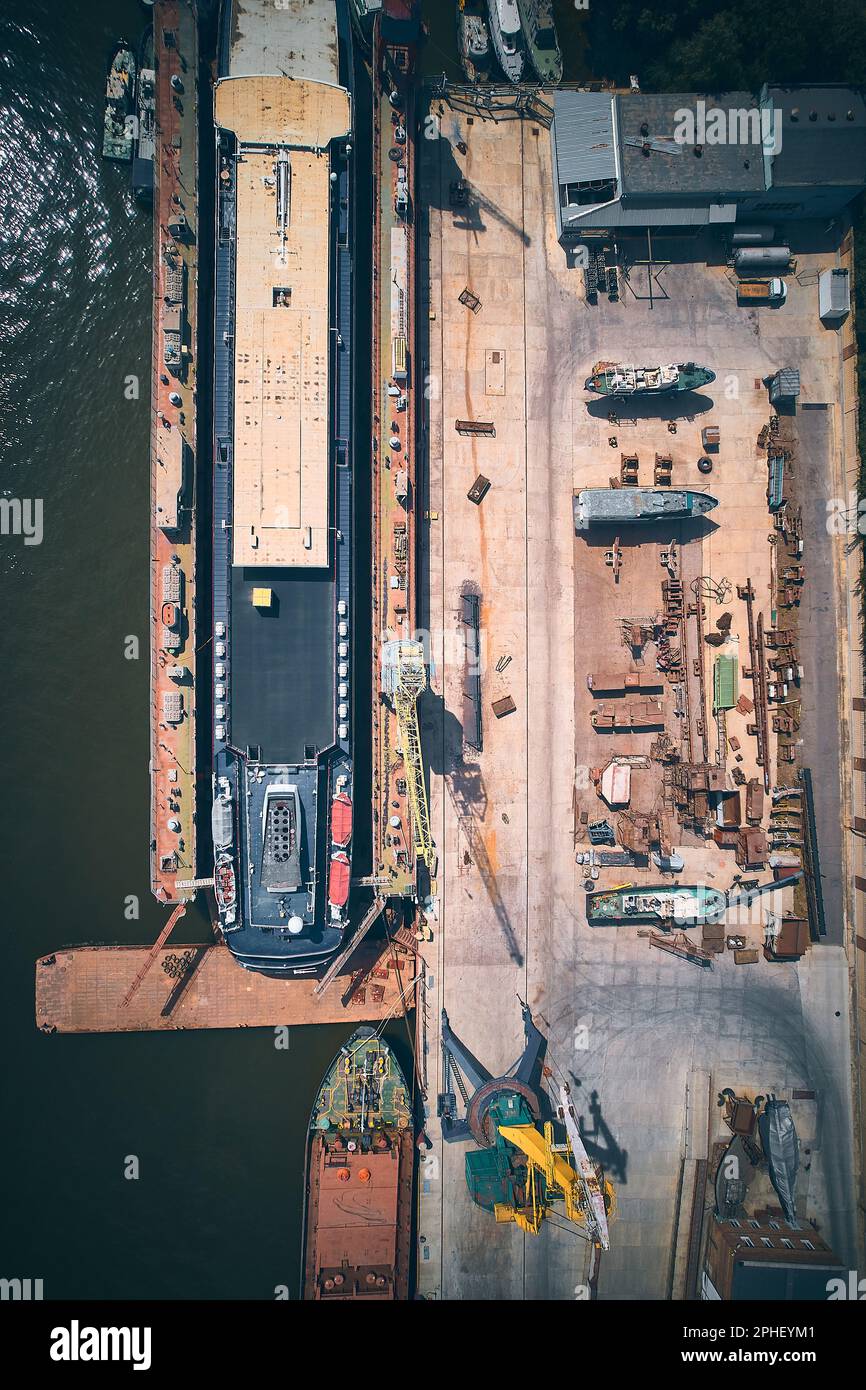 Top down aerial view of ship in a dry dock. Repair of bulk carrier ...