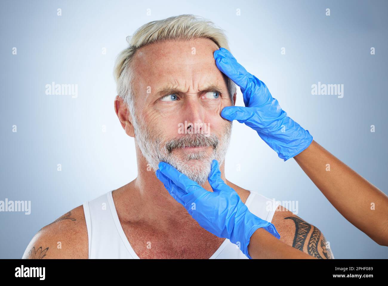 Needle, confused face and senior man in a studio doing plastic surgery ...