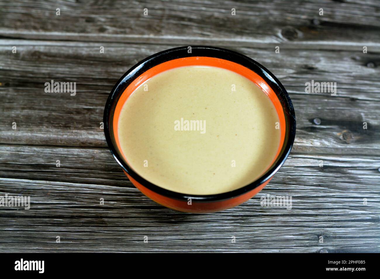 Bowl of Tahini Tahina which is a Middle Eastern condiment made from ...