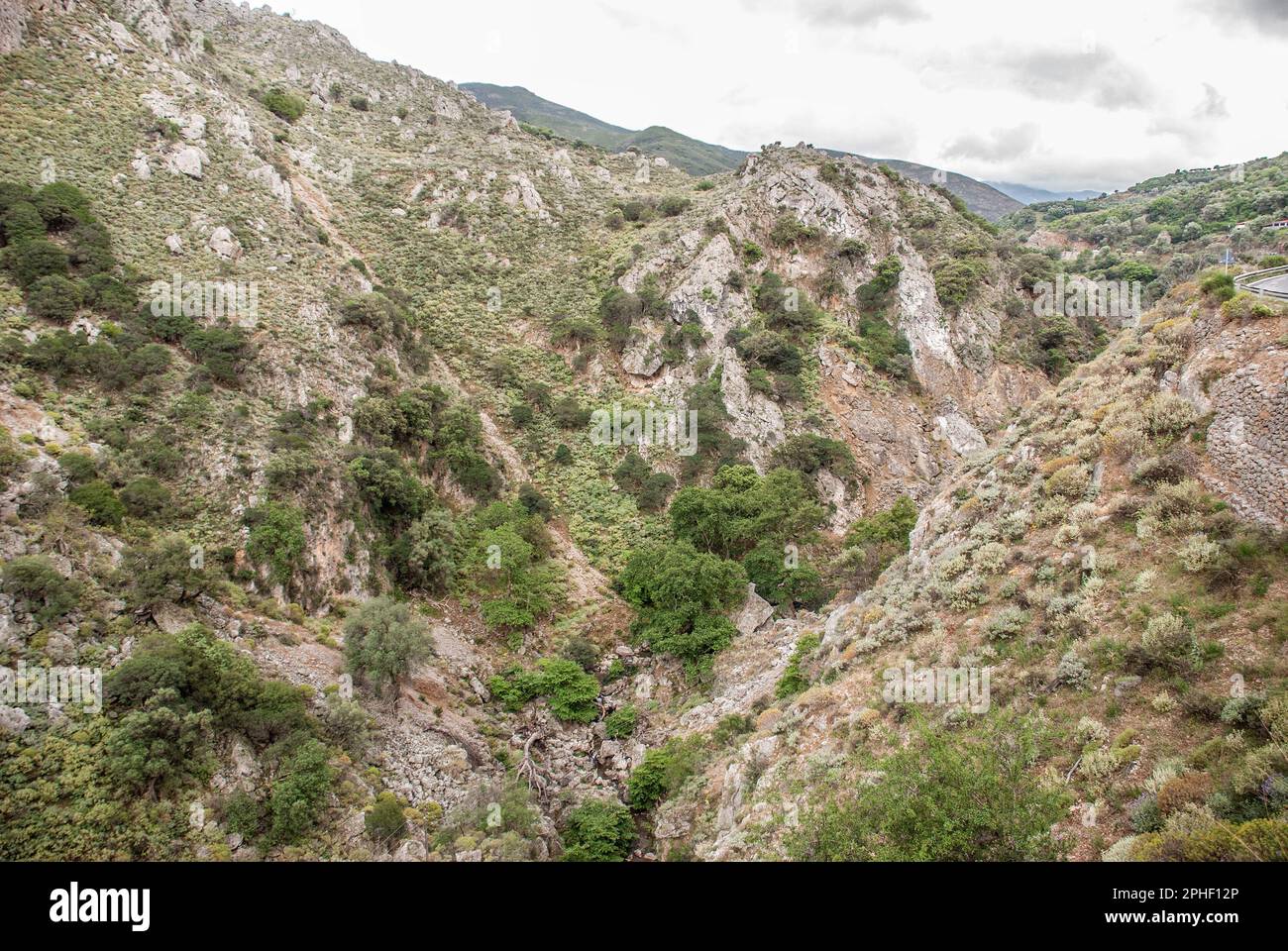 Gorge walking in Crete along the bottom of high-sided canyon with ...