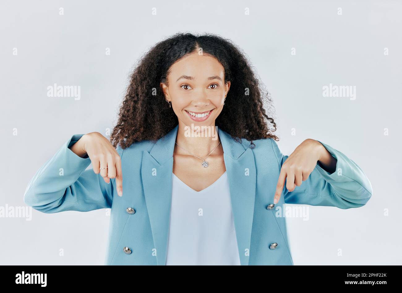Business woman, pointing down and studio portrait for mockup, promotion ...