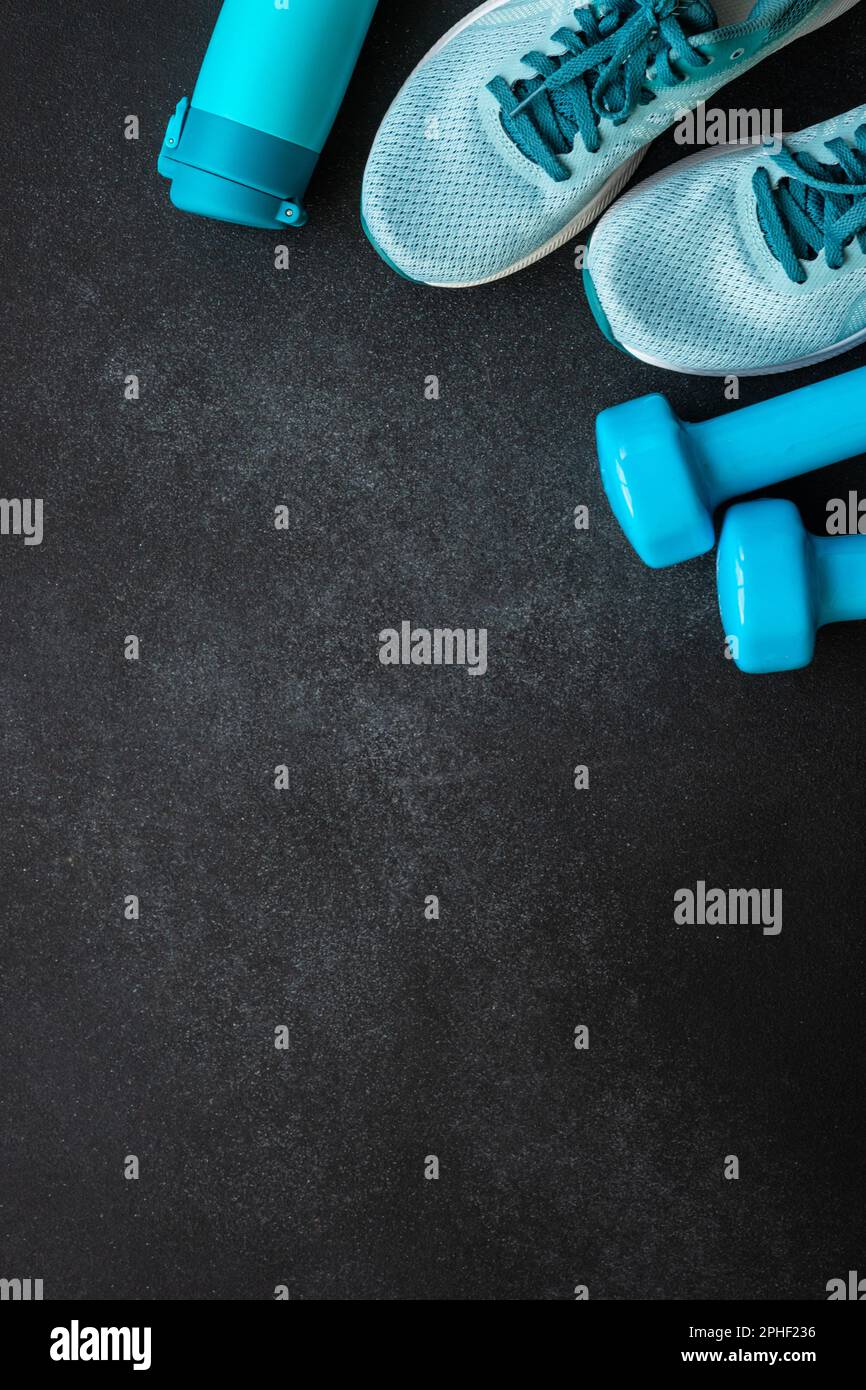 Fitness equipment at black background top view Stock Photo - Alamy