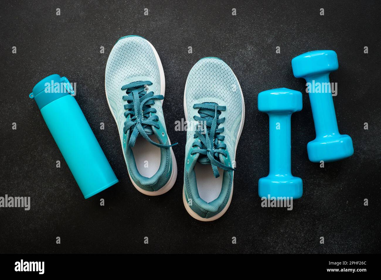 Fitness equipment at black background top view Stock Photo - Alamy