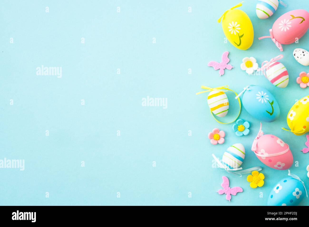Easter background with Eggs, rabbit and spring flowers at blue ...