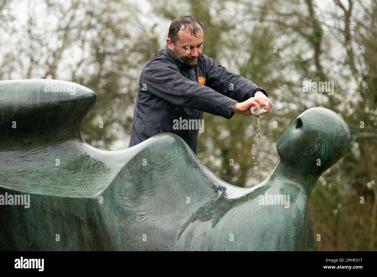 Sculpture technician Dai Roberts cleans and dries the bronze sculpture ...