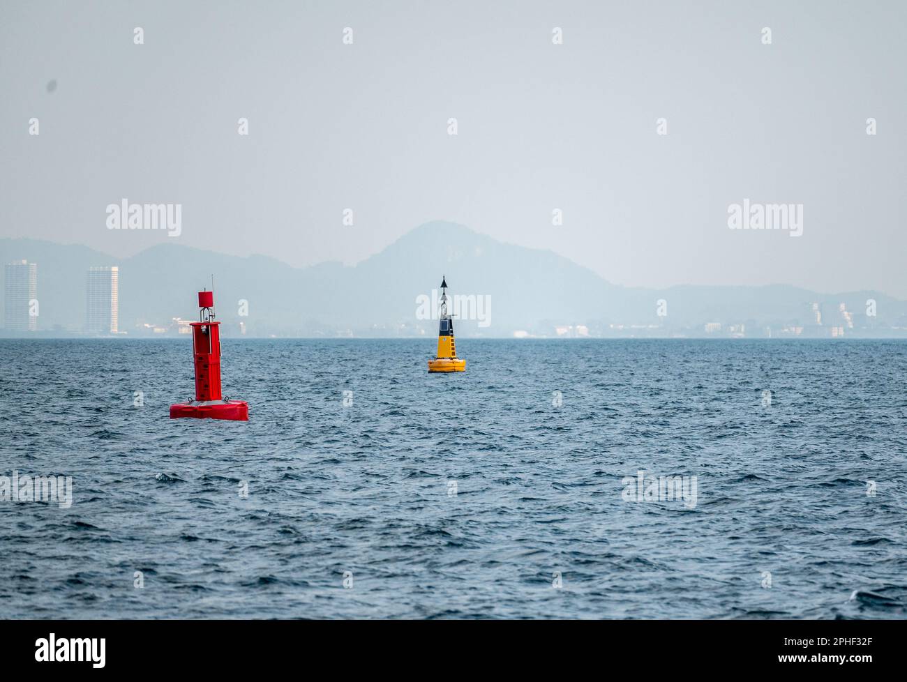 Marine red buoy in fairway. Navigational signs. Escorting ship to port ...