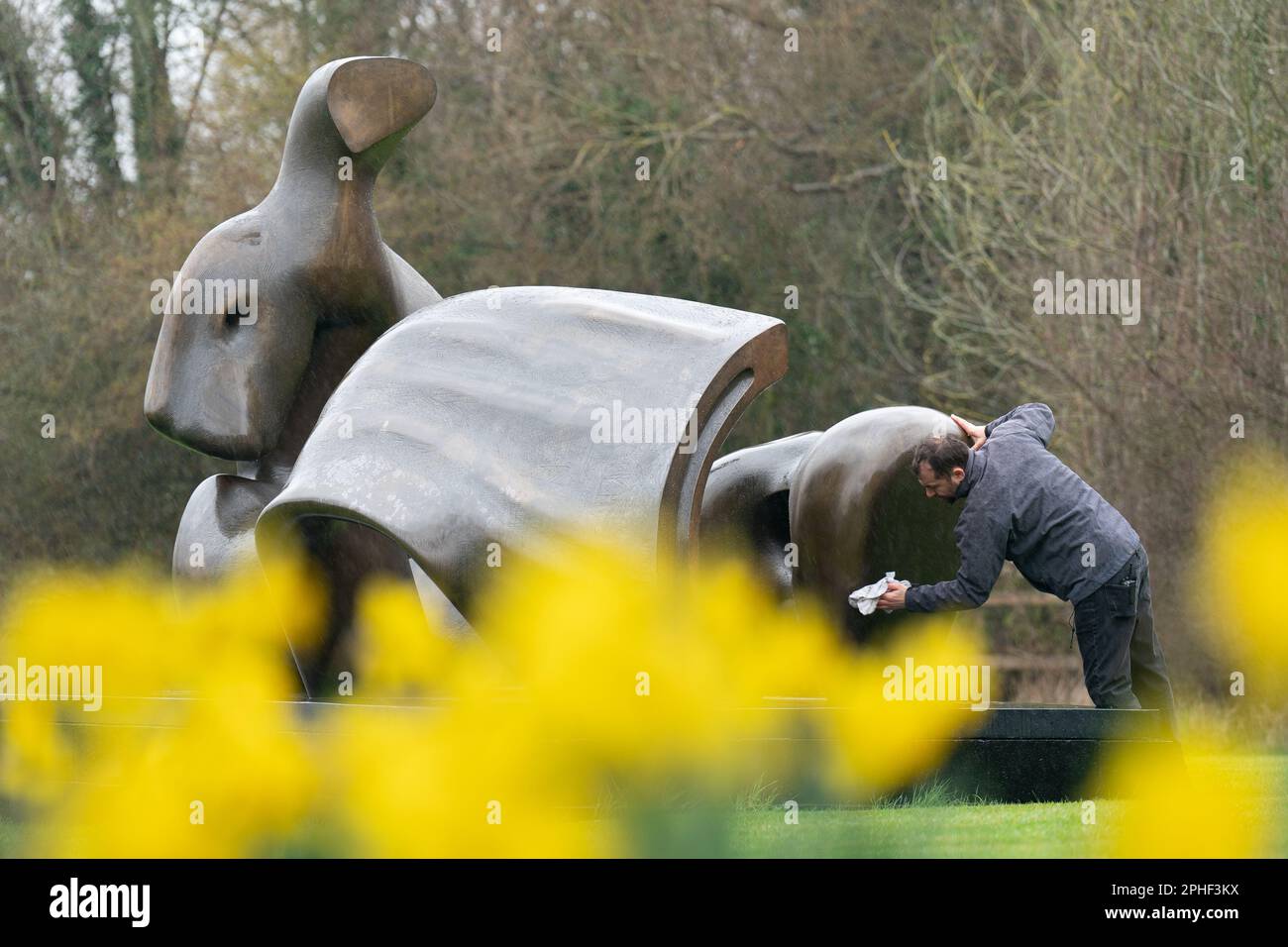 Sculpture technician Dai Roberts cleans and dries the bronze sculpture ...