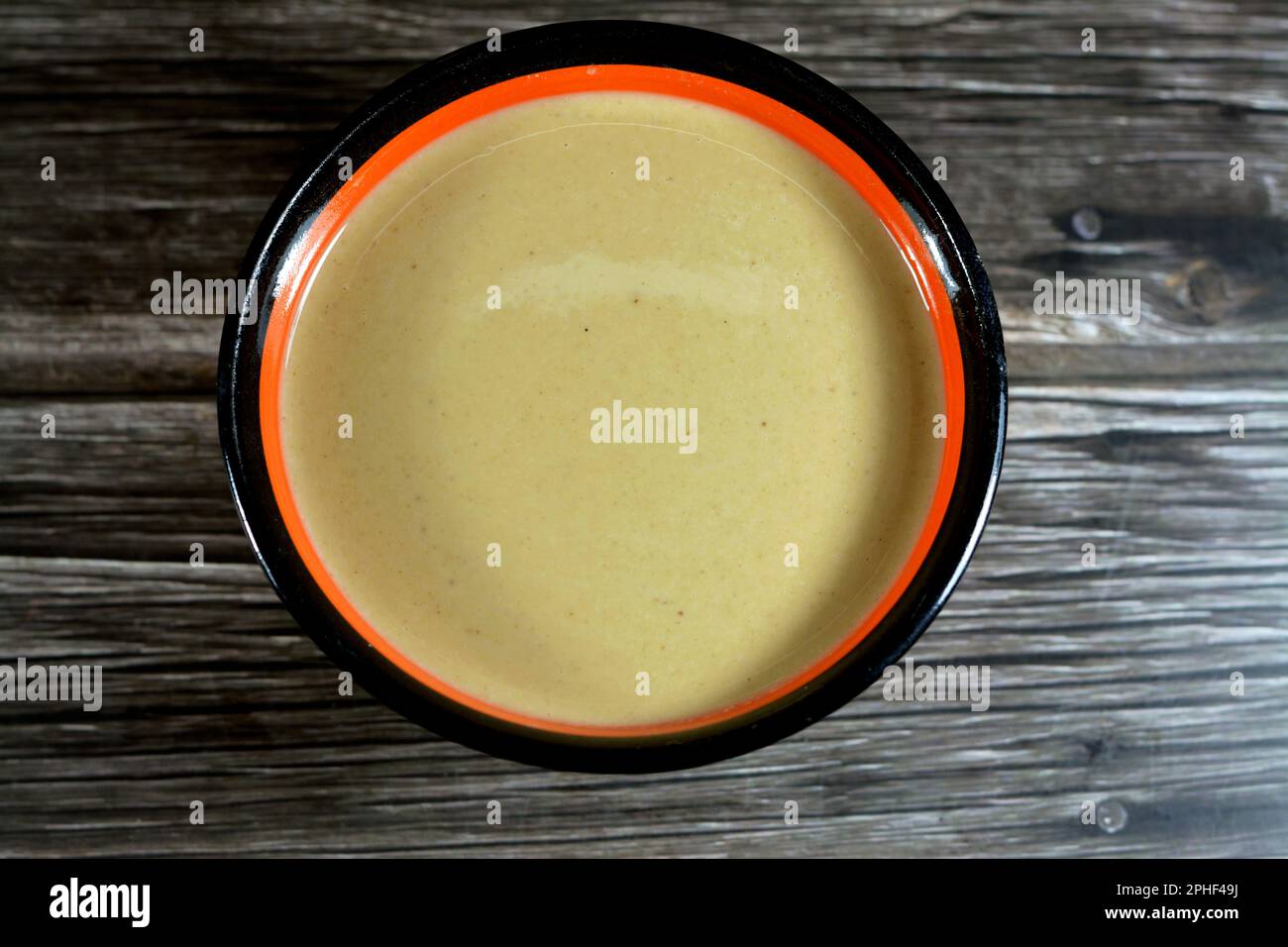 Bowl of Tahini Tahina which is a Middle Eastern condiment made from ...