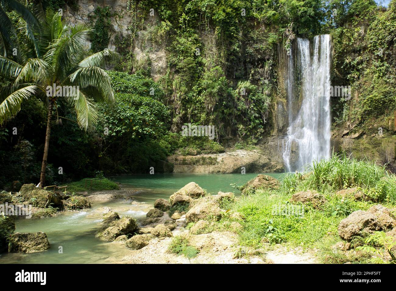 The idyllic Camugao Waterfall in Siquijor in the Philippines that flow ...
