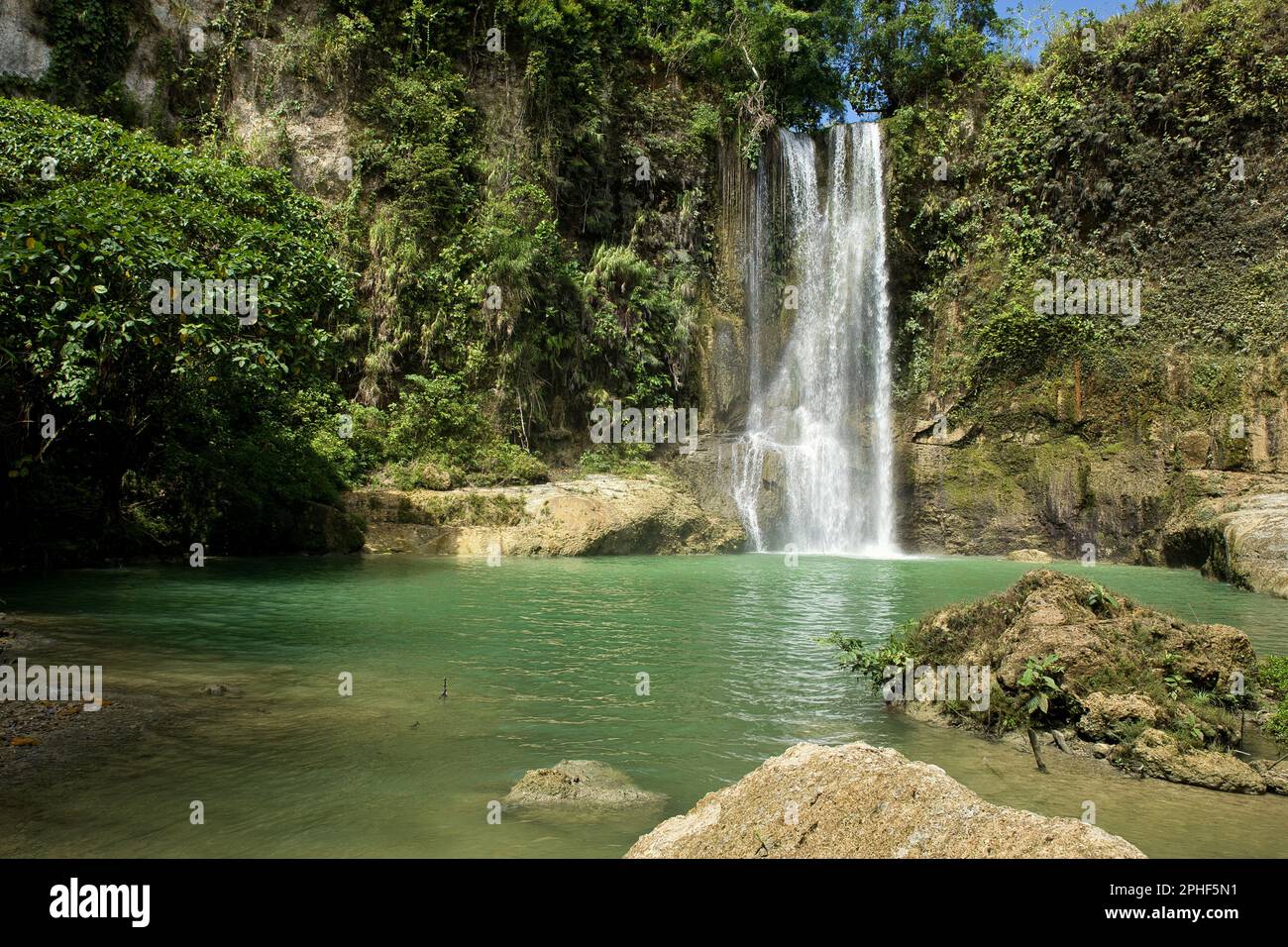 The idyllic Camugao Waterfall in Siquijor in the Philippines that flow ...