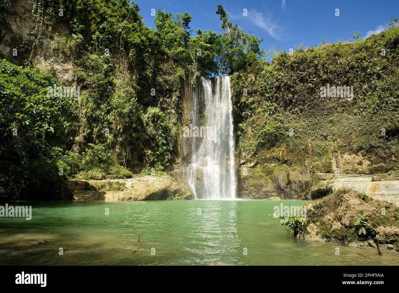 The idyllic Camugao Waterfall in Siquijor in the Philippines that flow ...