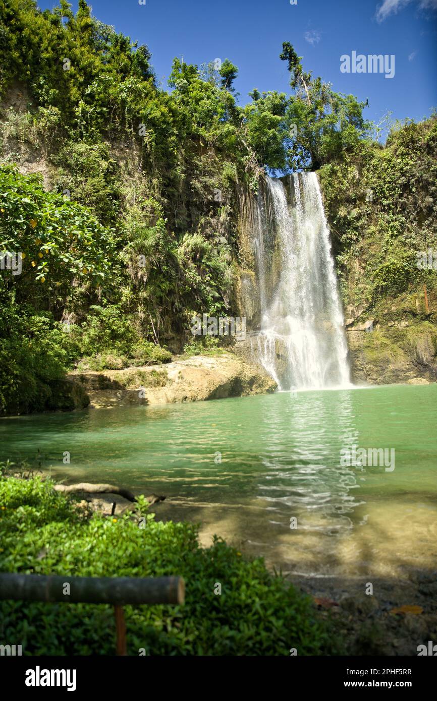 The idyllic Camugao Waterfall in Siquijor in the Philippines that flow ...